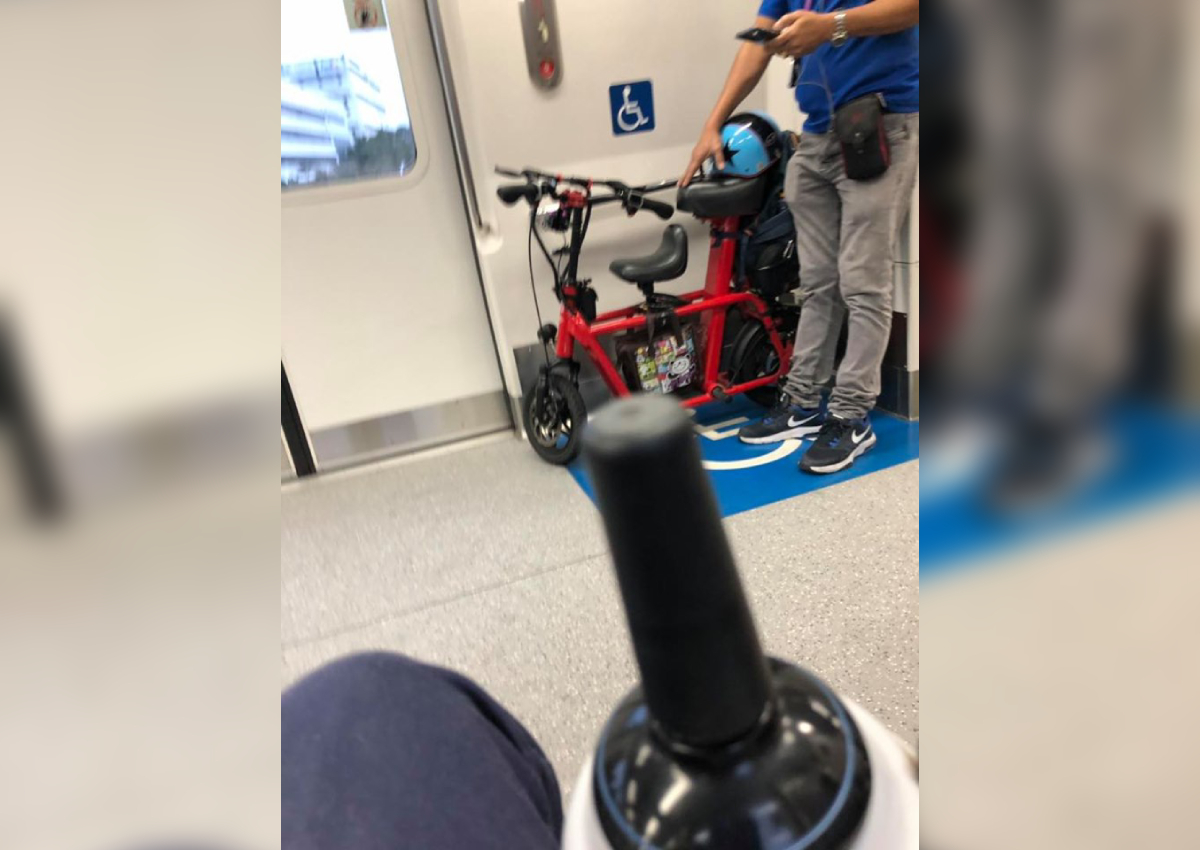 PMD user allegedly hogs wheelchair space on MRT train, ignores ...