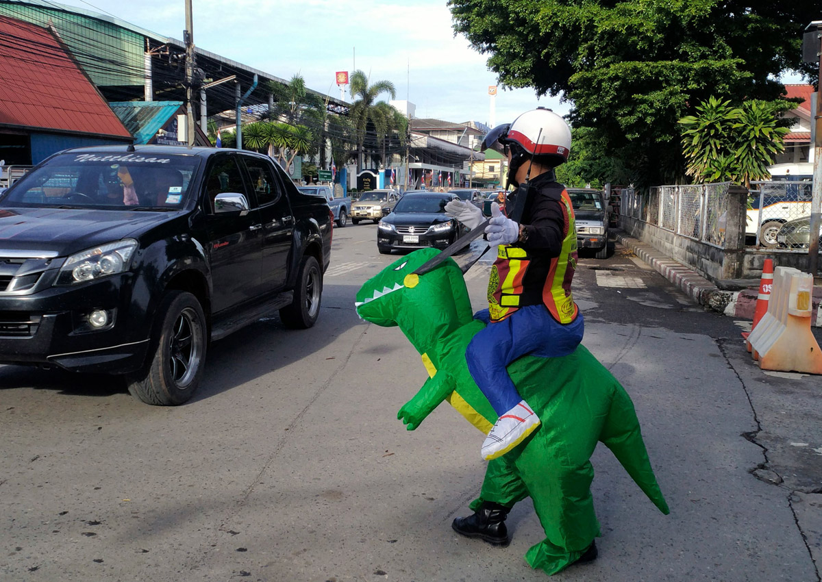 Doyouthinkhesaurus: Thai 'T-Rex' cop gives traffic safety lessons, Asia ...