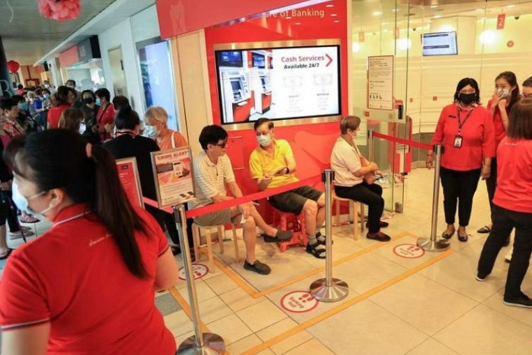 'I just came to try my luck': Long queues at banks for new CNY notes ...